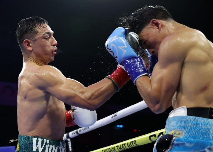 Photos: Angelo Leo KO's Luis Alberto Lopez to become two-weight ...